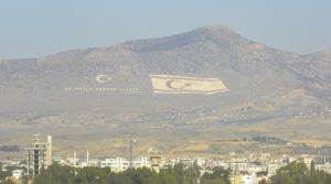 The Turkish flag and the motto of the Republic of Turkey, “How happy is ...